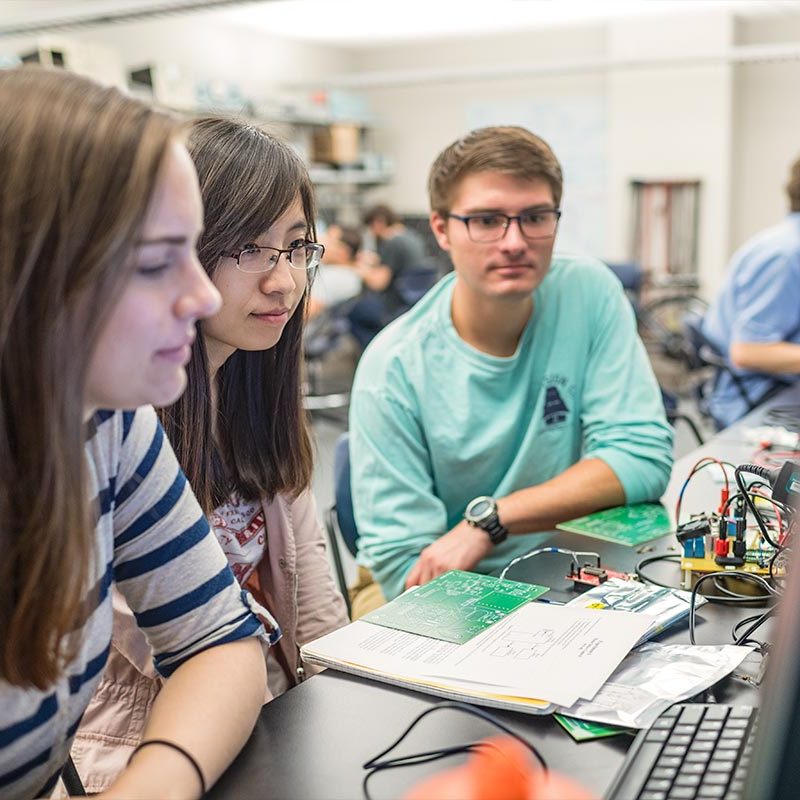 Three students work in the Power Lab | Min H. Kao Department of ...